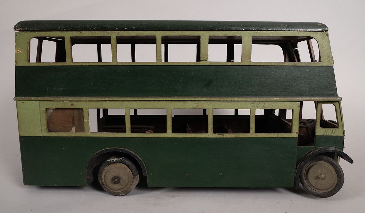 Circa 1920s wooden models of a ship and a double deck bus. | Whyte's