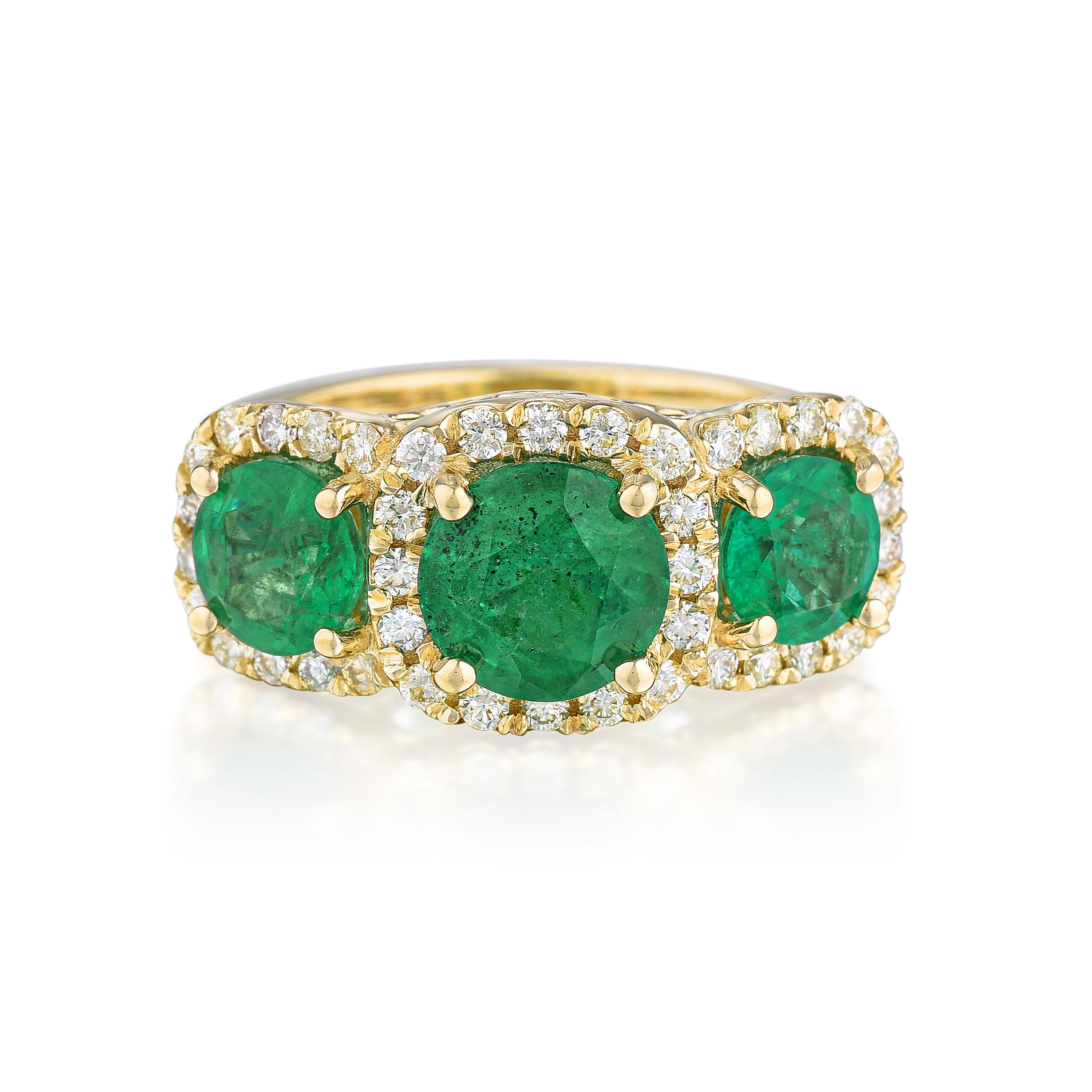 Oscar Friedman Three-Stone Emerald and Diamond Halo Ring | Barnebys