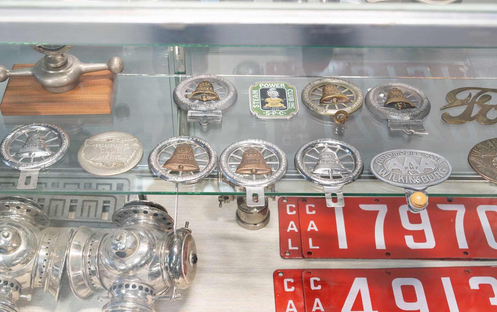 Assorted Car Club Badges, License Plates, and Steering Wheels | Gooding ...